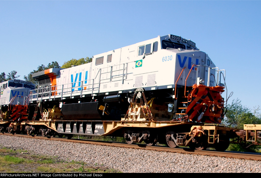 VLI BB40-9WM #6030 is one of 8 locomotives in this train heading east bound for the port of ...
